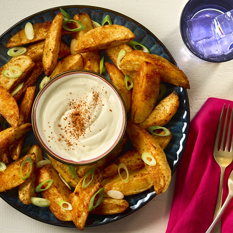 Crispy Potato Wedges with Spring Onions and Sour Cream | Schwartz